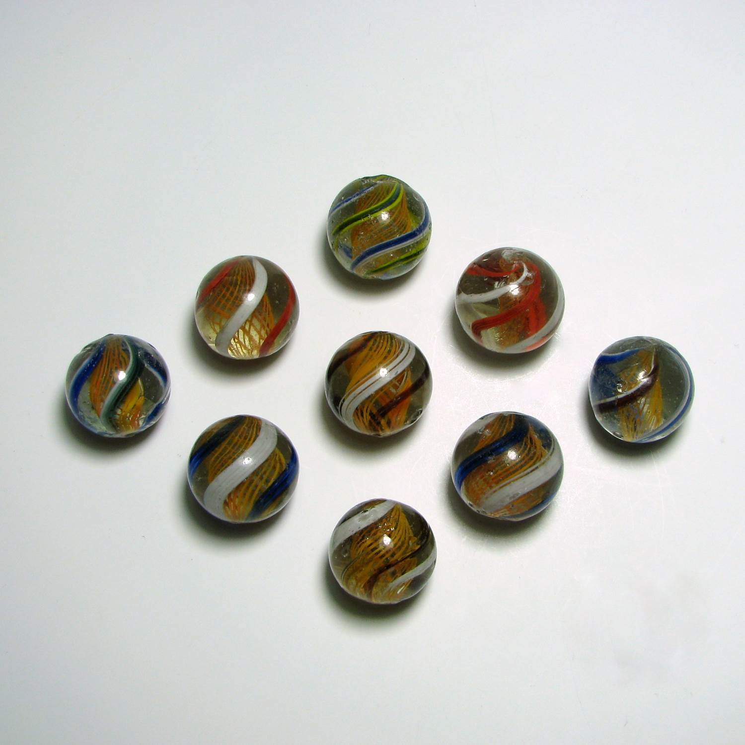 Nine German Yellow Latticinio Core Marbles 2.5cm c1860