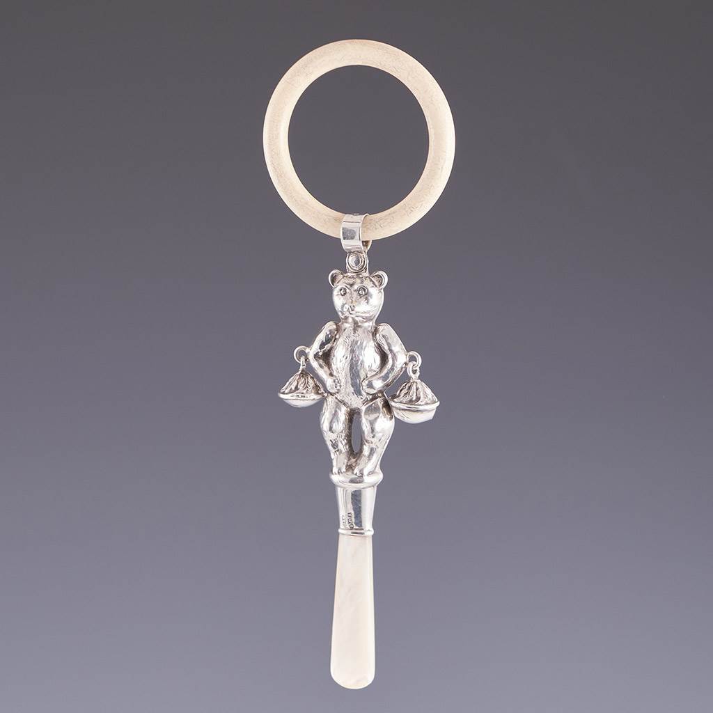 A Sterling Silver Rattle And Teething Ring Soother Birmingham 1927