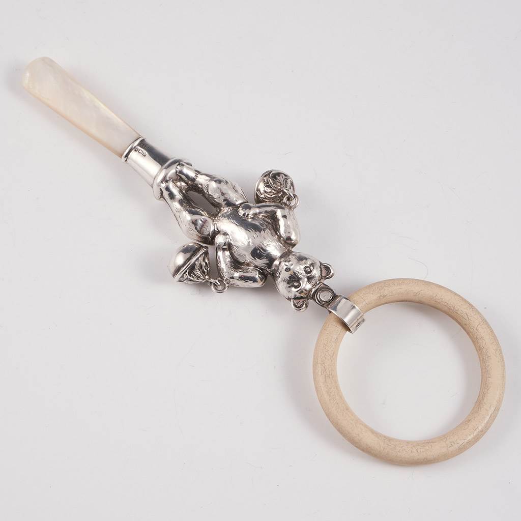 A Sterling Silver Rattle And Teething Ring Soother Birmingham 1927