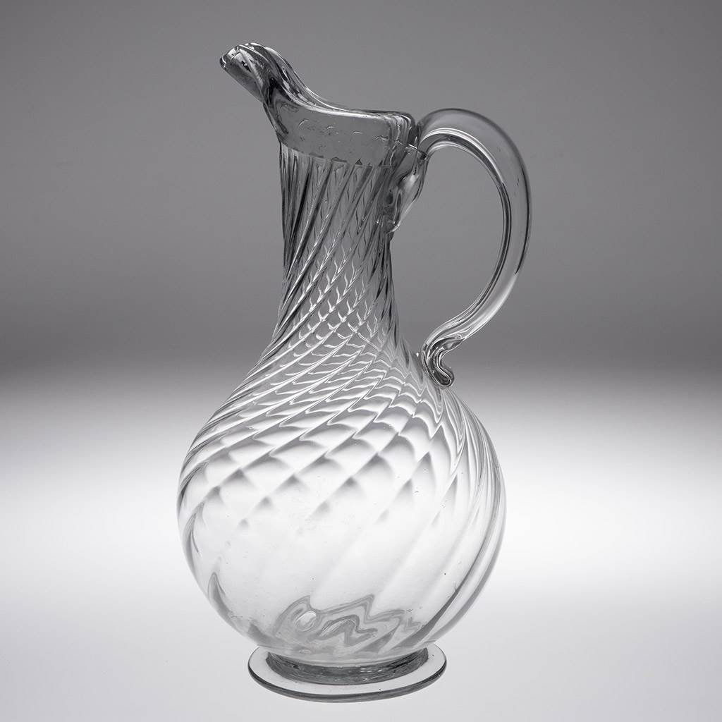 A Fine Large Wrythen Moulded Glass Cider Jug c1820