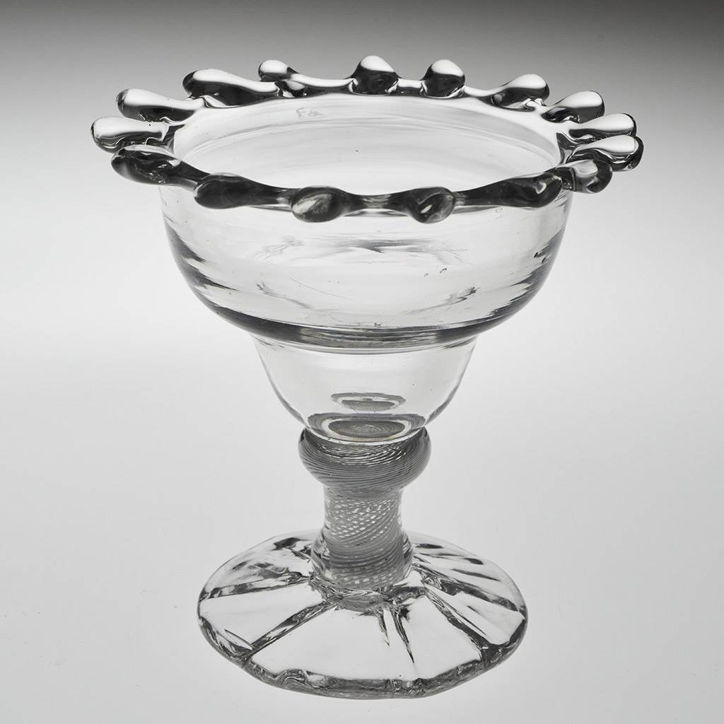 A Dog-Tooth Rim 18th Century Sweetmeat Glass With Opaque Twist Stem c1760